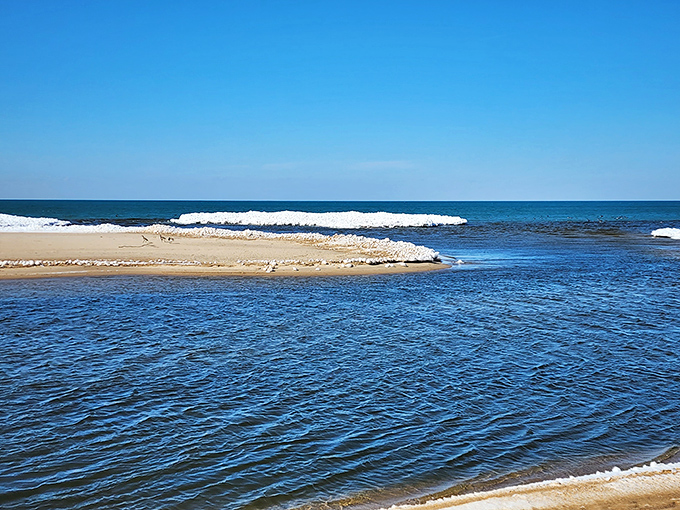 Where Lake Huron whispers its secrets through sandbars and shallow channels&mdash;pure Michigan magic at its finest.