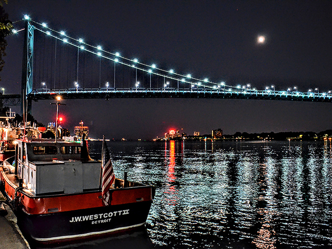Night shift magic! The Westcott glows against the darkness, ready for 24-hour service beneath Detroit's illuminated bridge.