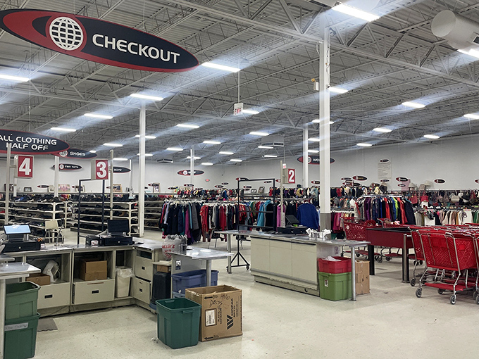 The checkout area efficiently guides shoppers through numbered lanes, where friendly cashiers process the day's treasures without judgment.