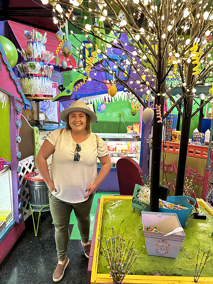 The shop transforms visitors of all ages into wide-eyed explorers, navigating a forest of treats under twinkling lights.