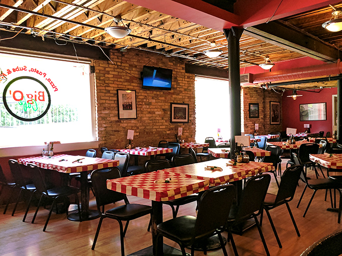 Red checkered tablecloths add a touch of classic Italian pizzeria charm to the modern basement space &ndash; tradition meets innovation in every detail.