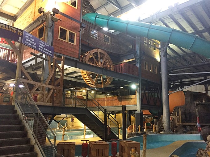 Multi-level fun awaits inside, where wooden walkways connect various attractions in this frontier-inspired aquatic playground.