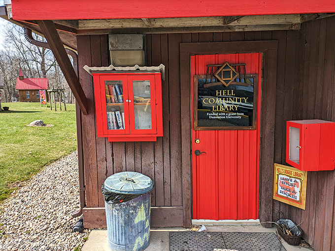 Even Hell has a community library with a charming red door. Turns out eternal damnation comes with a decent reading selection.