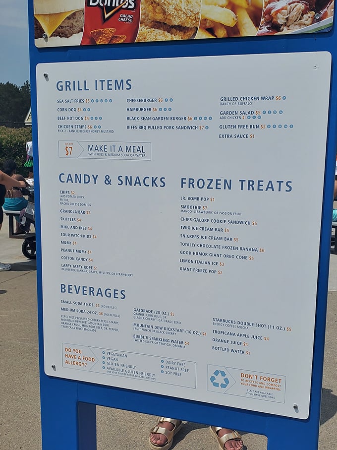 The menu board showcases summer classics from juicy burgers to frozen treats &ndash; because swimming works up an appetite that rivals a hibernating bear's.