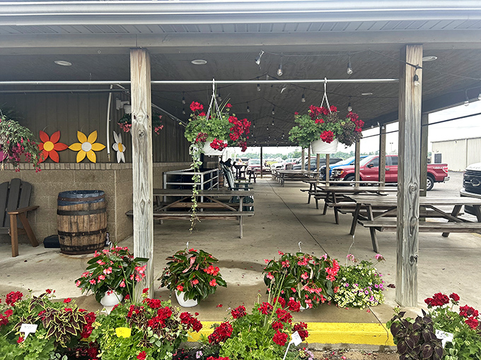 The outdoor seating area, adorned with hanging flowers, offers a perfect spot to immediately surrender to whatever treat you couldn't resist.