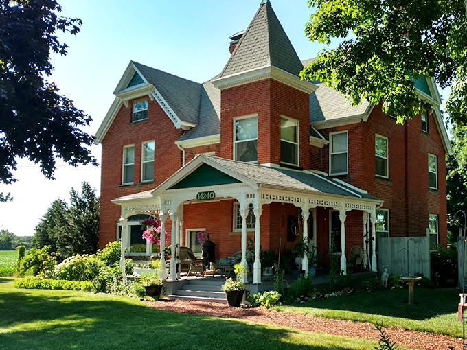 The Brickhouse presents its most welcoming face, with Victorian architecture, wraparound porch, and gardens that frame this historical treasure.