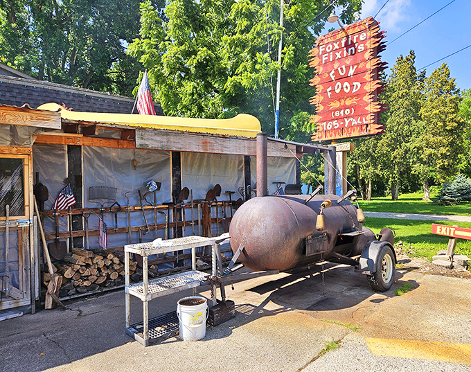 The outdoor smoker stands like a sentinel of flavor, transforming humble meat into BBQ masterpieces through patience and smoke.