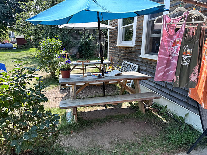 Picnic tables under bright umbrellas create the perfect spot to savor your coffee while soaking up that gorgeous Upper Peninsula sunshine.