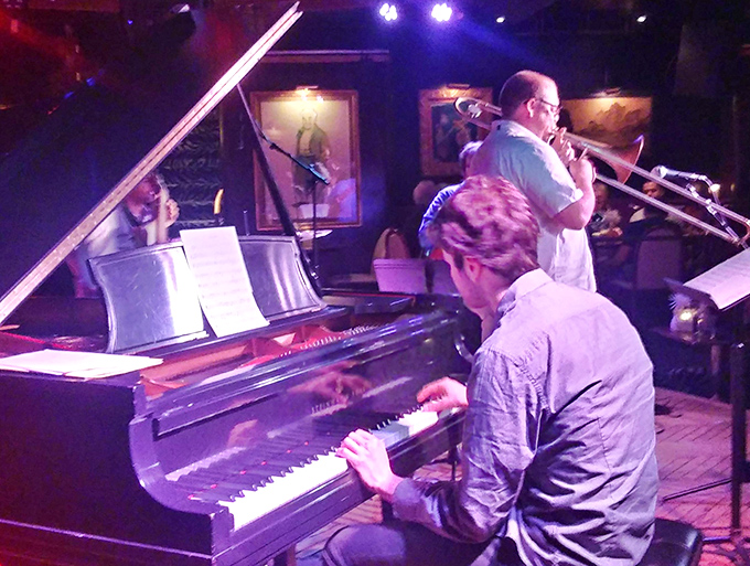 The pianist's fingers dance across keys while the trombonist adds brass punctuation, creating musical sentences that need no translation.