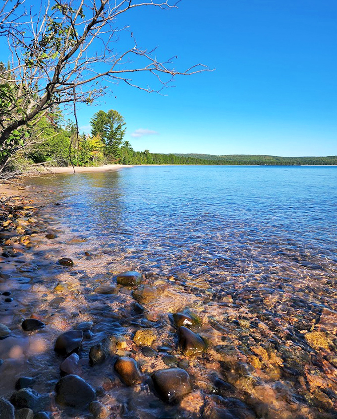Sunlight dances across Superior's crystal-clear shallows, turning ordinary rocks into underwater treasures.