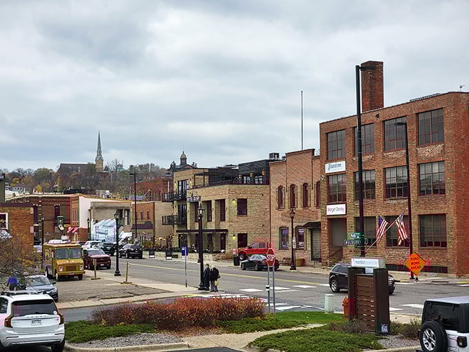 Brick buildings climb the hillside like architectural stepping stones, church spires punctuating the skyline with historic elegance.