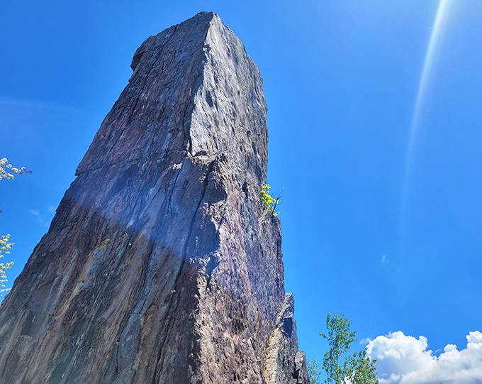 The monolith reaches toward heaven, a natural exclamation point against the perfect Minnesota sky. Its silhouette has remained unchanged for millennia.