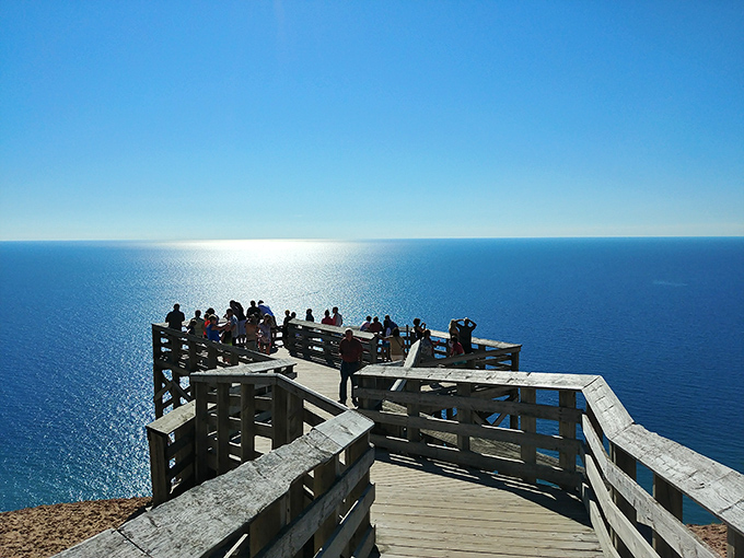 The wooden viewing platform offers the perfect frame for Lake Michigan's vastness. Just try not to drop your phone while capturing the perfect shot.