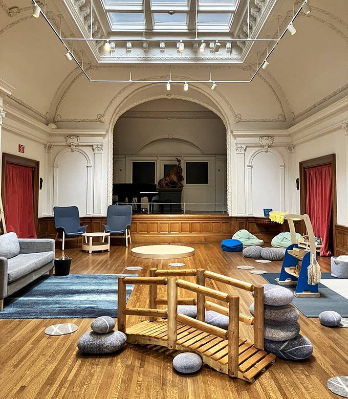 The children's activity area transforms formal spaces into playful learning environments where little hands can build bridges between cultures.