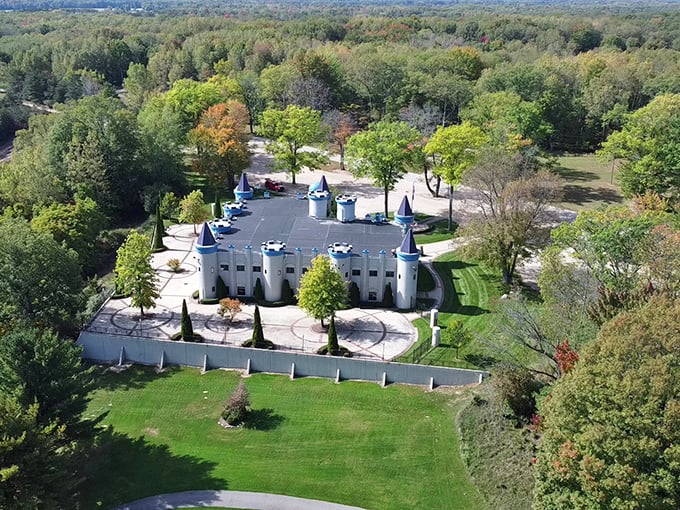 An aerial view reveals how perfectly the castle sits within its surroundings, a fairytale structure nestled among Michigan's natural beauty.