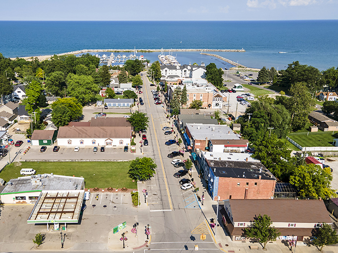 This aerial view reveals Lexington's perfect layout, where every road leads to water and the harbor cradles boats like precious gems.