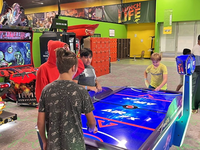 Air hockey battles bring out competitive spirits across generations. The puck moves fast, but the trash talk moves faster.