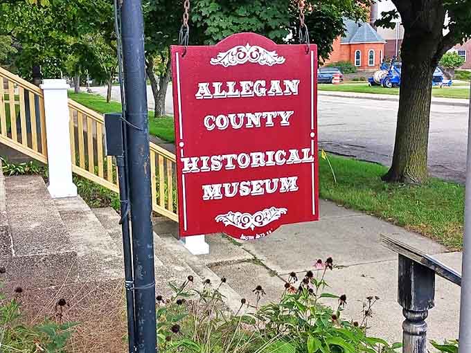 The distinctive red sign welcomes visitors to a journey through time at the Allegan County Historical Museum.