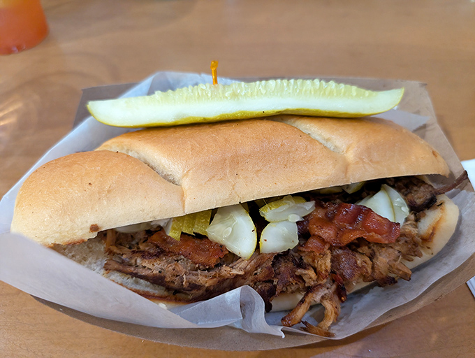 This isn't just pulled pork on bread &ndash; it's a perfectly pressed symphony of meat, pickles, and mustard that would make Havana proud.