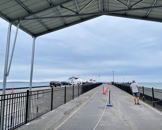 The dock area bustles with activity as excited passengers prepare to board for their transformation from tourists to fearsome pirates of the Great Lakes.