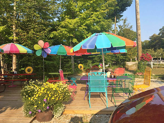 The outdoor patio invites lingering, with cheerful furniture and abundant flowers making every meal feel like a special occasion worth celebrating.