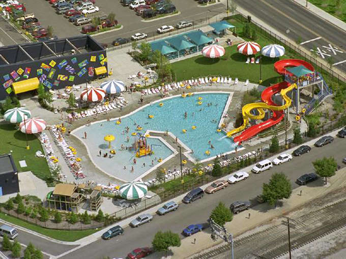 The aerial view reveals how this compact facility maximizes every square foot for maximum splash, proving bigger isn't always better when it comes to summer fun.