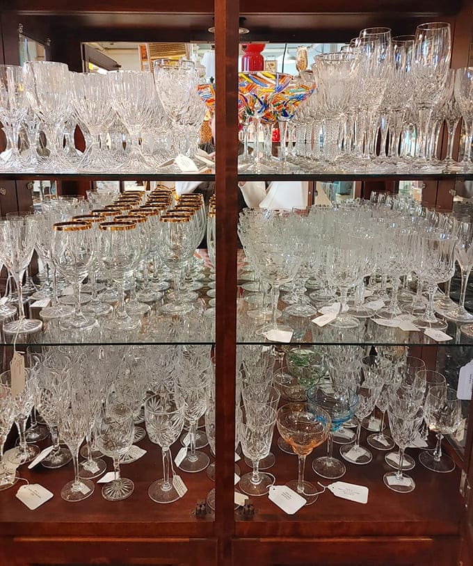 Crystal stemware stands in elegant formation, each delicate glass having toasted weddings, anniversaries, and countless "just because" moments throughout the decades.