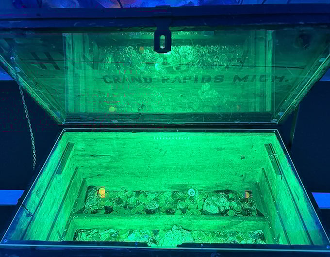 A treasure chest of glowing minerals creates an otherworldly grotto effect, like stumbling upon alien artifacts during your round.