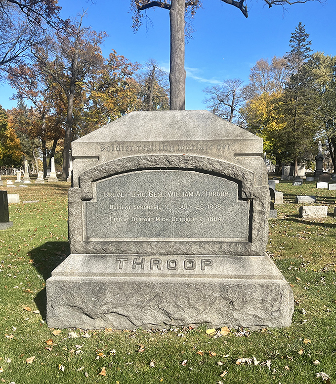 General Throop's substantial marker honors his Civil War service, the weathered stone connecting modern visitors to America's defining conflict.