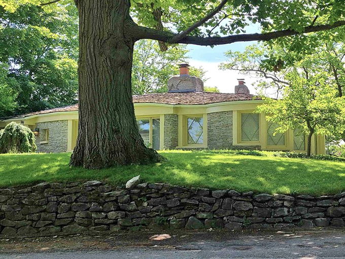 Horizontal stonework creates visual interest in this mid-century gem, where Young's distinctive style evolved while maintaining its connection to nature.