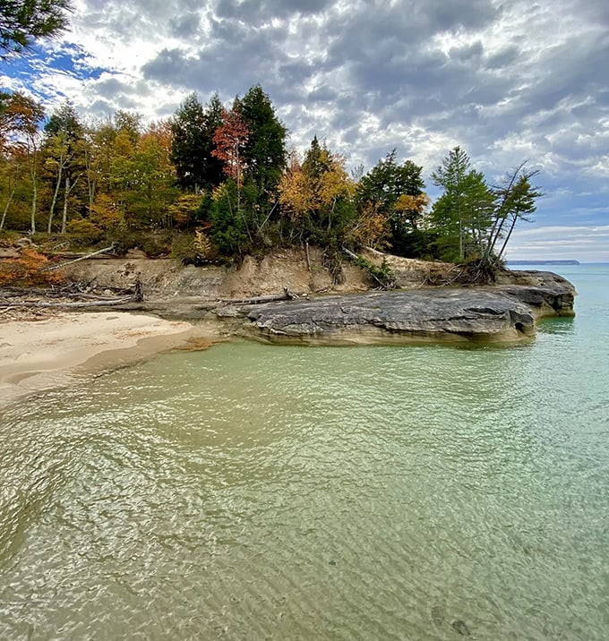 Turquoise waters lap against a pristine shoreline, creating a scene so perfect it looks like Michigan's answer to the Caribbean.