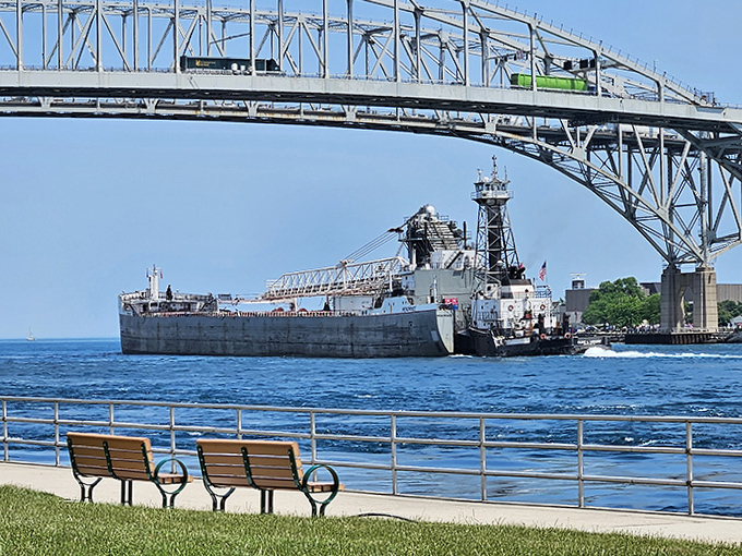 Industrial might meets natural beauty as massive cargo vessels navigate the narrow channel, a dance of commerce that's been performed here for generations.