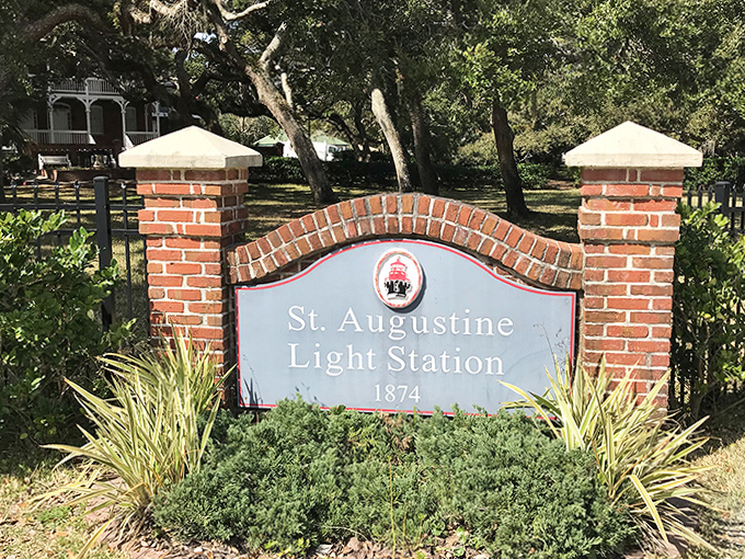 The entrance sign welcomes visitors to St. Augustine Light Station, established 1874, though local spirits have been in residence much longer.