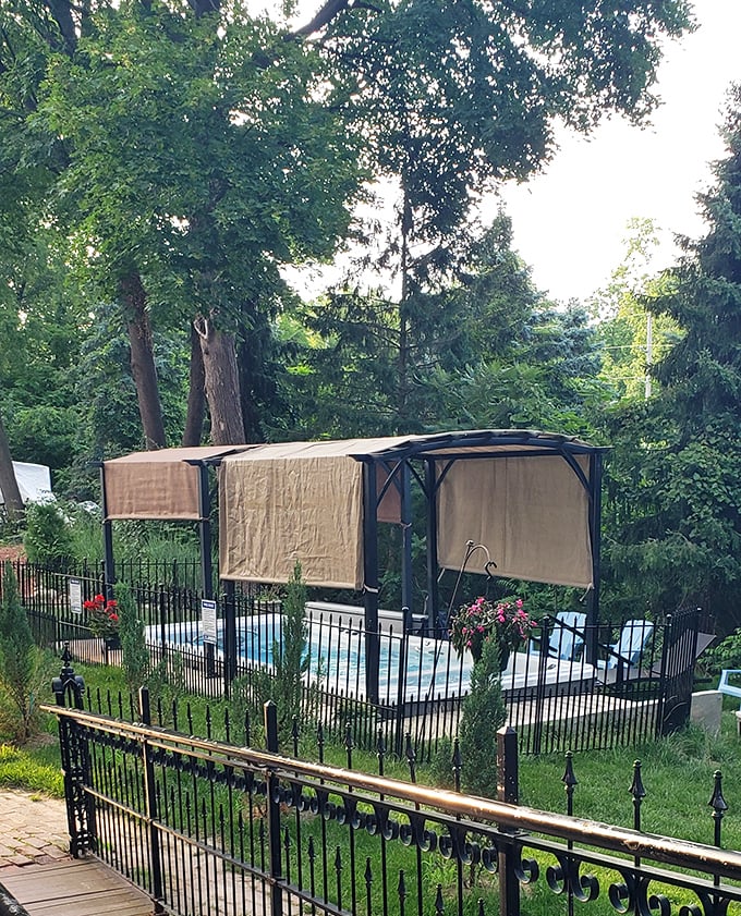 A secluded pool area offers refreshing relaxation for castle guests, surrounded by greenery and protected from prying eyes.