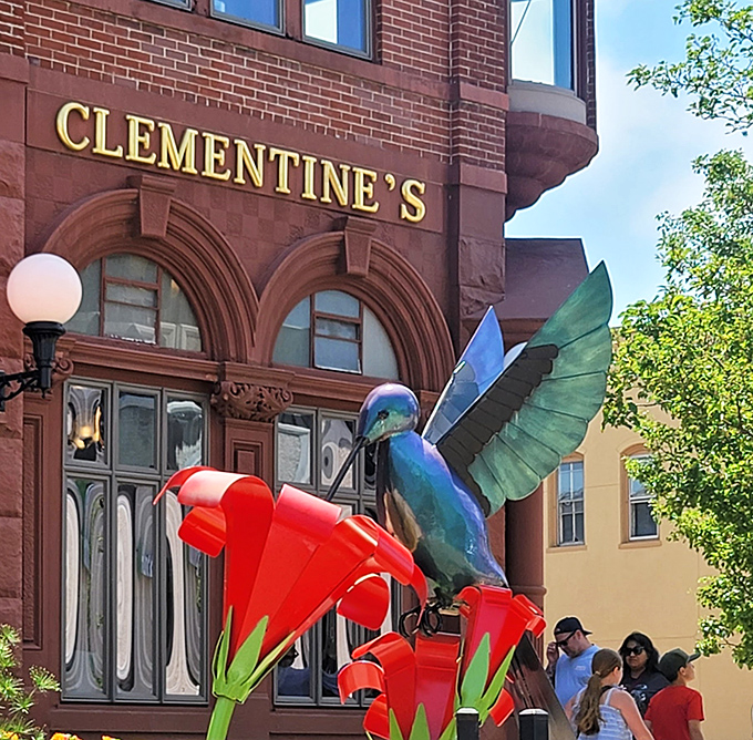 The iconic Clementine's sign welcomes visitors, while the whimsical hummingbird sculpture adds a touch of artistic flair to this beloved establishment.