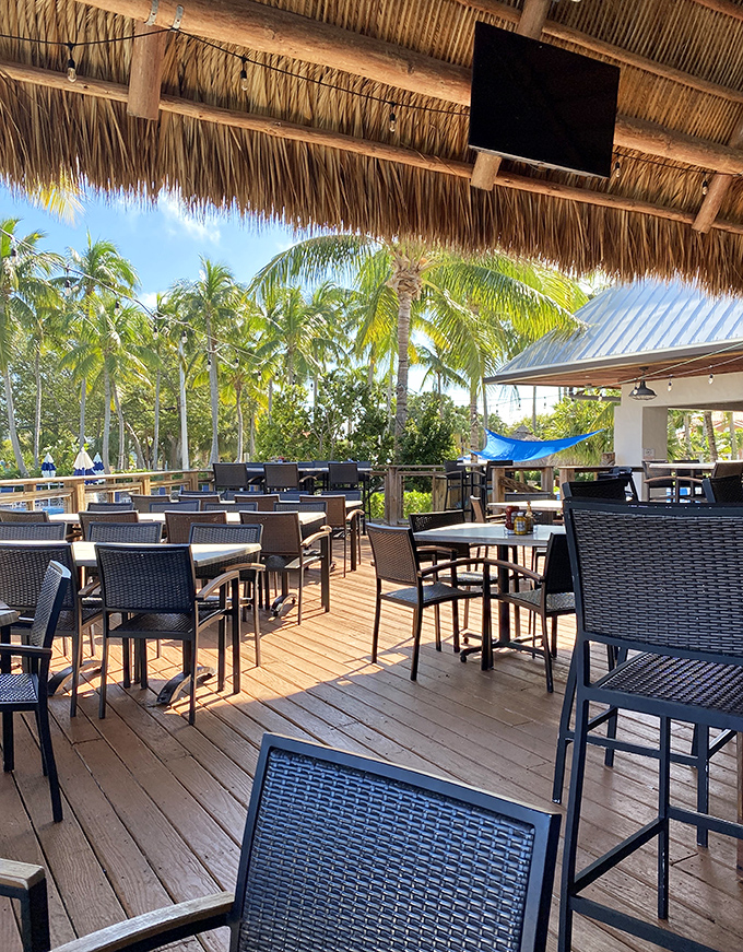 The outdoor seating area frames nature's artwork &ndash; swaying palms and endless sky &ndash; while comfortable chairs invite you to settle in for the afternoon show.