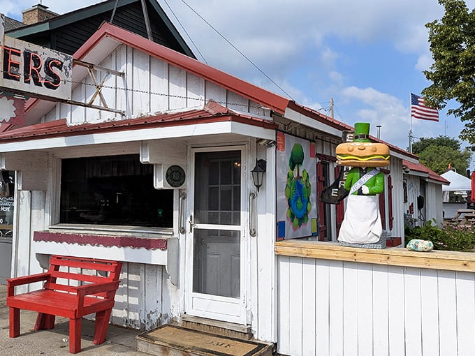 A slice of Americana on a small-town sidewalk &ndash; where the red bench invites you to sit a spell before diving into diner delights.
