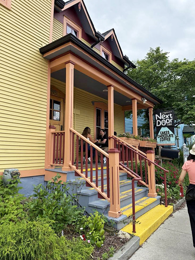 The charming yellow exterior with its inviting porch creates a neighborhood gathering spot where strangers become friends over shared appreciation of exceptional food.