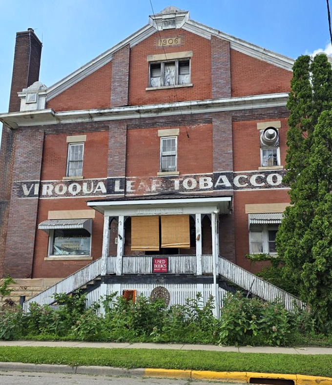 The full facade of the historic tobacco warehouse reveals its 1906 origins, now repurposed as Wisconsin's most magical literary labyrinth.