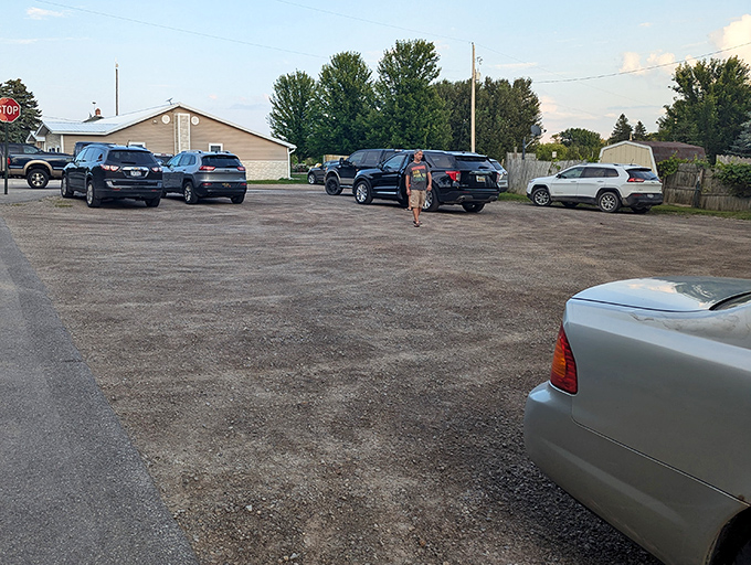 The humble parking lot tells its own story &ndash; trucks beside luxury SUVs, a testament to Hoppies' appeal across all walks of life.