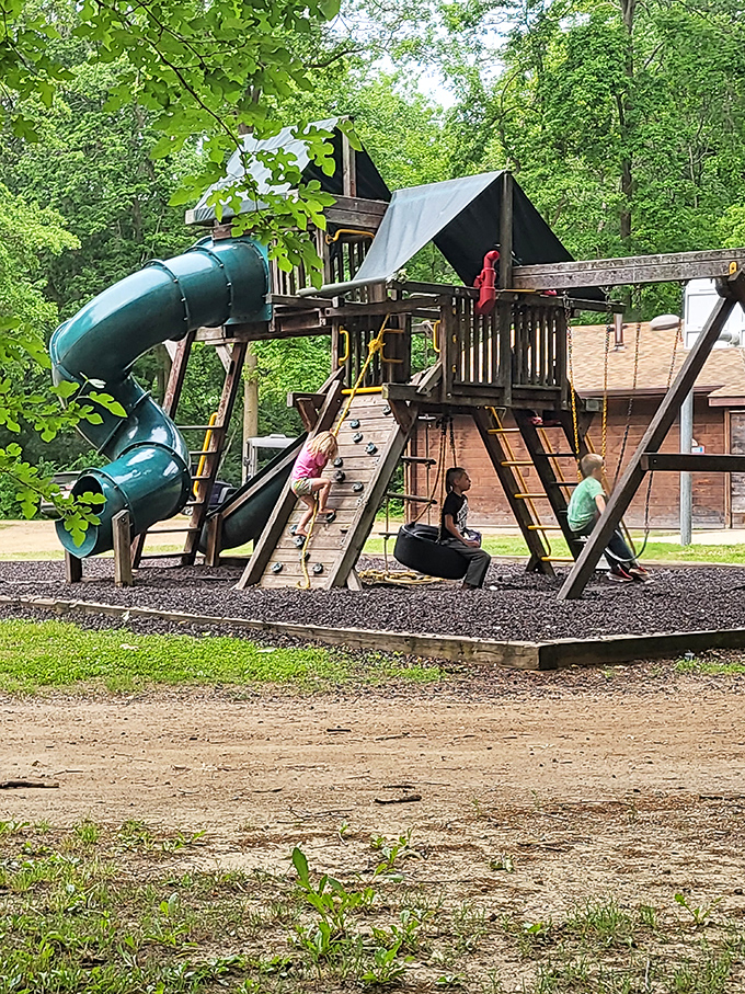 Childhood unleashed: The playground becomes a hub of activity where young adventurers burn off energy between cave tours and swimming sessions.