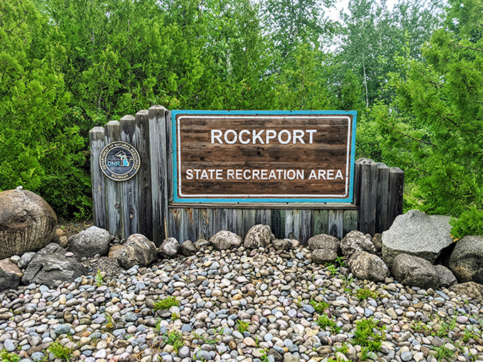 The rustic entrance sign welcomes fossil hunters and nature lovers to one of Michigan's most fascinating geological wonders.