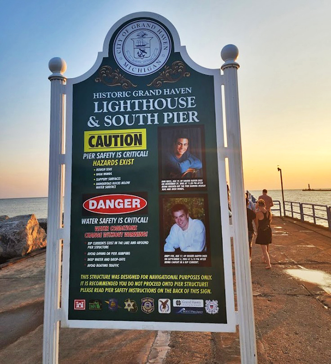 Safety warnings remind visitors of Lake Michigan's power, while honoring those who've made the ultimate sacrifice in these waters.