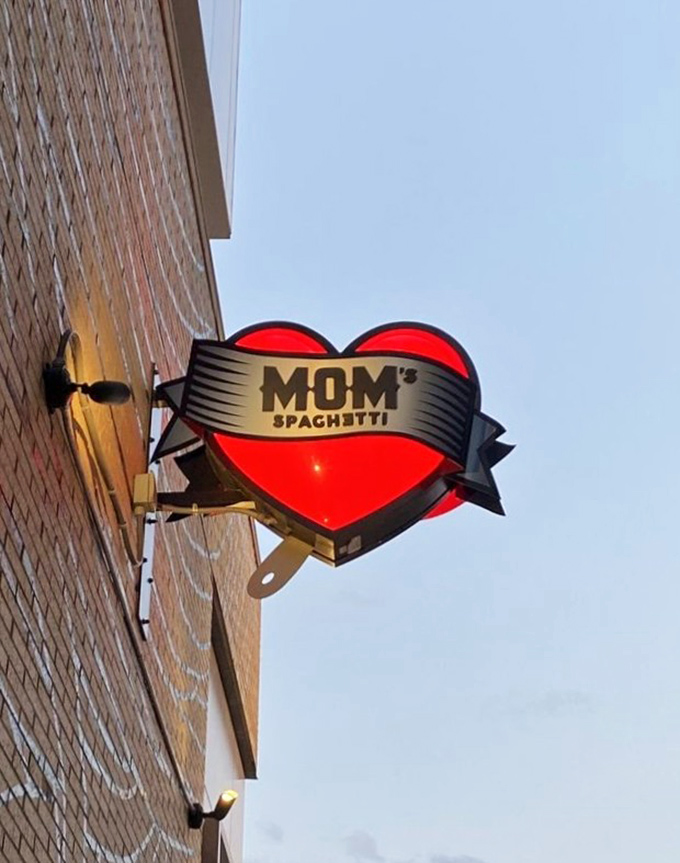 This illuminated heart-shaped sign serves as a beacon for carb enthusiasts, its fork-pierced design perfectly capturing the restaurant's playful spirit.
