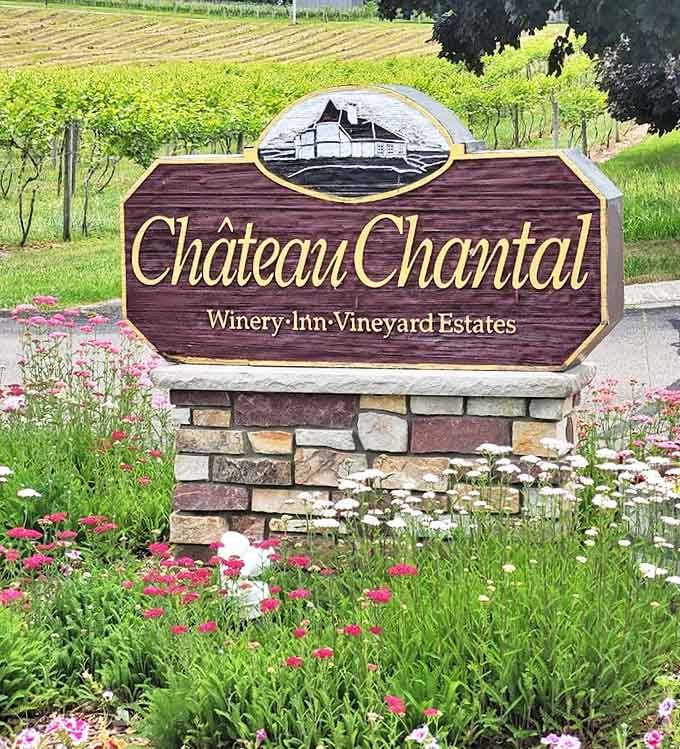 Wildflowers frame the entrance sign, offering a colorful Michigan welcome to this slice of wine paradise.