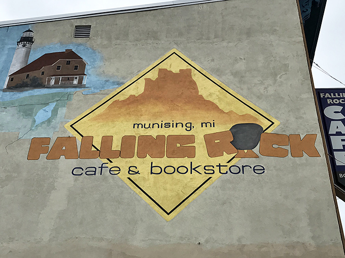 The sign says it all: Falling Rock Cafe & Bookstore, where Munising's quirkiest concept became its most beloved reality.