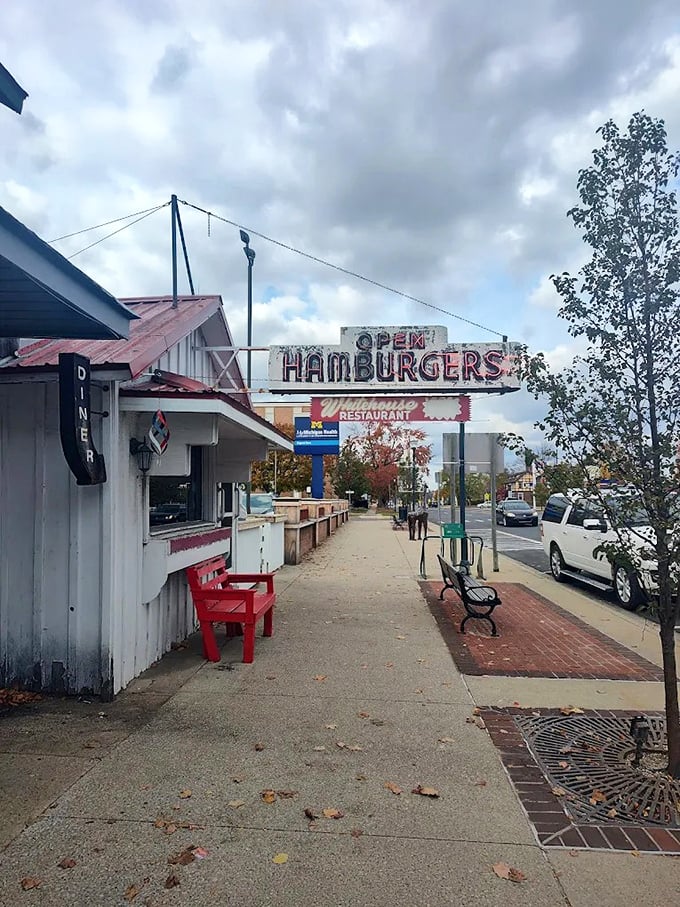 The restaurant's exterior view shows its prime position on Clare's main street – a humble building that's been serving extraordinary burgers to grateful Michiganders for generations.