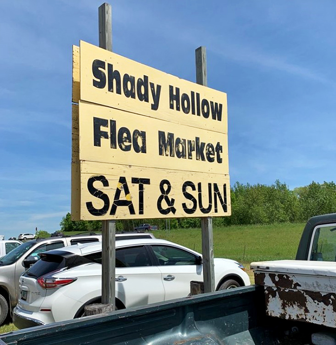 The simple yellow sign announces weekend shopping adventures, drawing treasure hunters from across Minnesota to this 11-acre wonderland.
