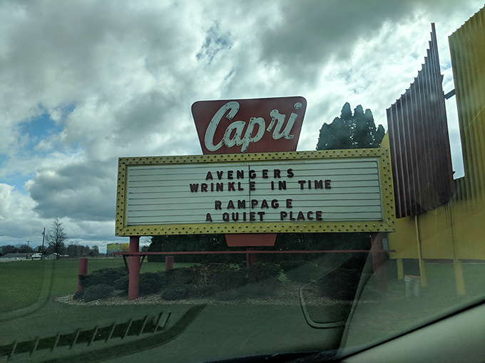 The classic Capri marquee announces current features, a beacon of entertainment that has drawn Michigan moviegoers for generations of summer nights.