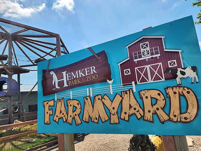 Farmyard meets exotic adventure: Hemker's charming signage reflects the zoo's blend of educational value and family fun.